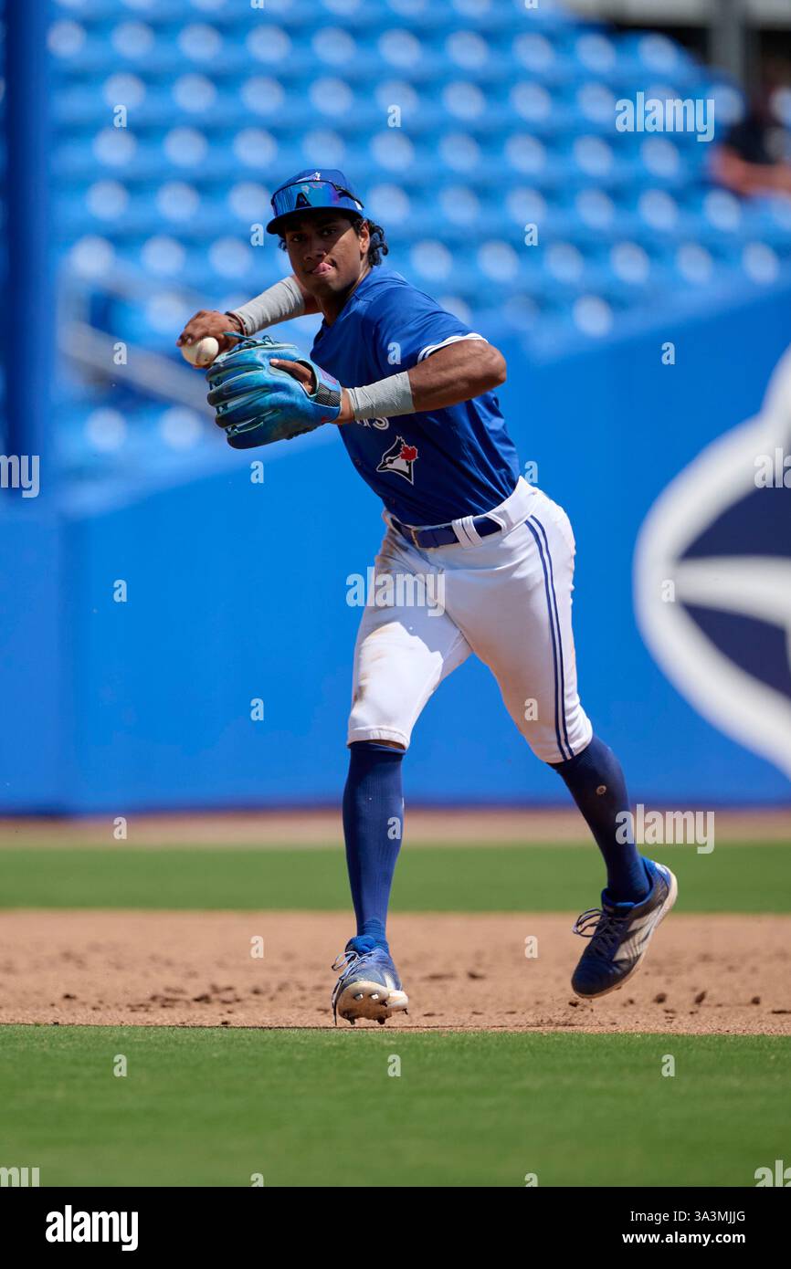 Toronto Blue Jays shortstop Arjun Nimmala (15) throws to first base ...