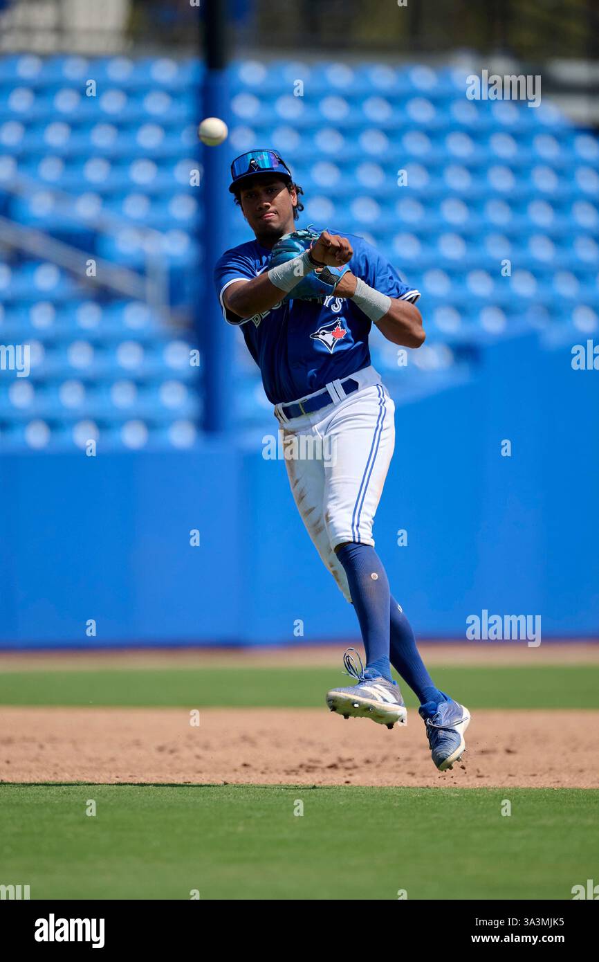 Toronto Blue Jays shortstop Arjun Nimmala (15) throws to first base ...