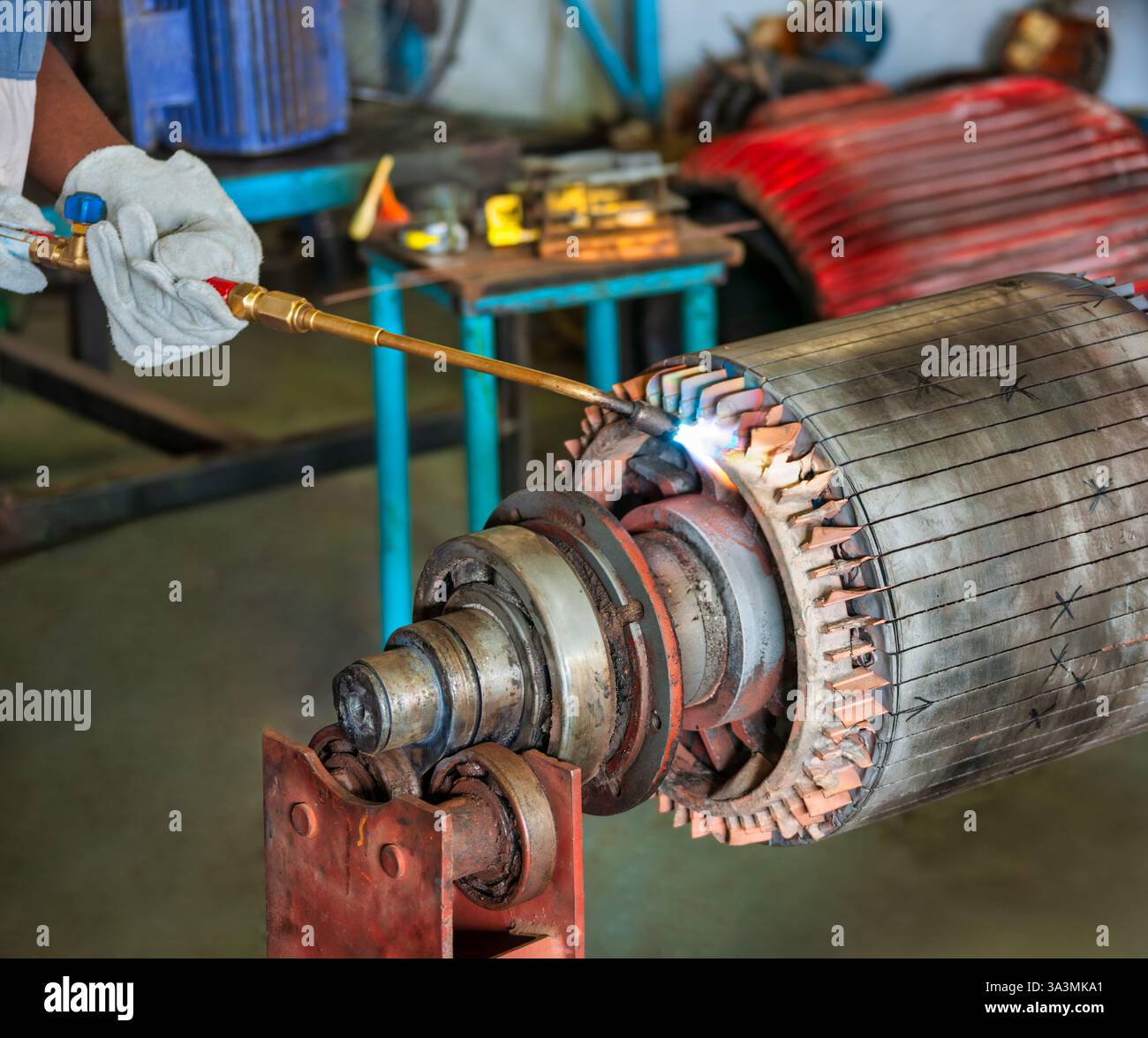 in the factory, is rebuilding with a flame acetylene torch prepare to ...