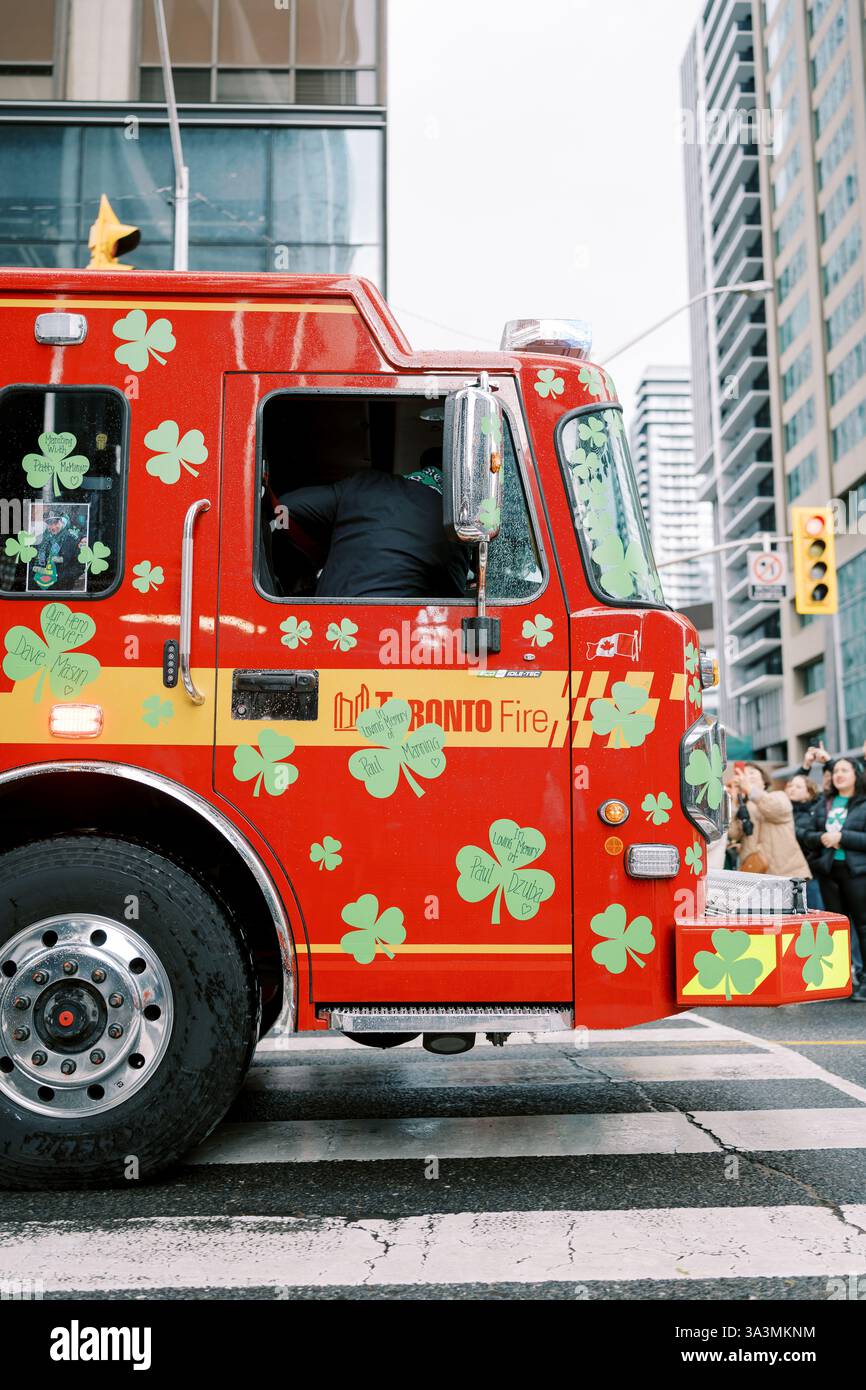 Canada, Toronto - 16 march 2025: Saint Patrick Day Parade. Festive Fire Truck with Shamrocks for ...