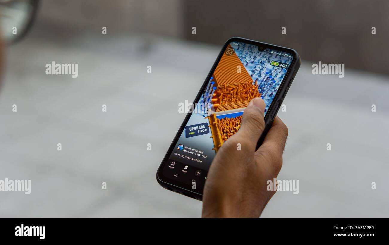 A hand is scrolling YouTube. Looking for something in YouTube short ...