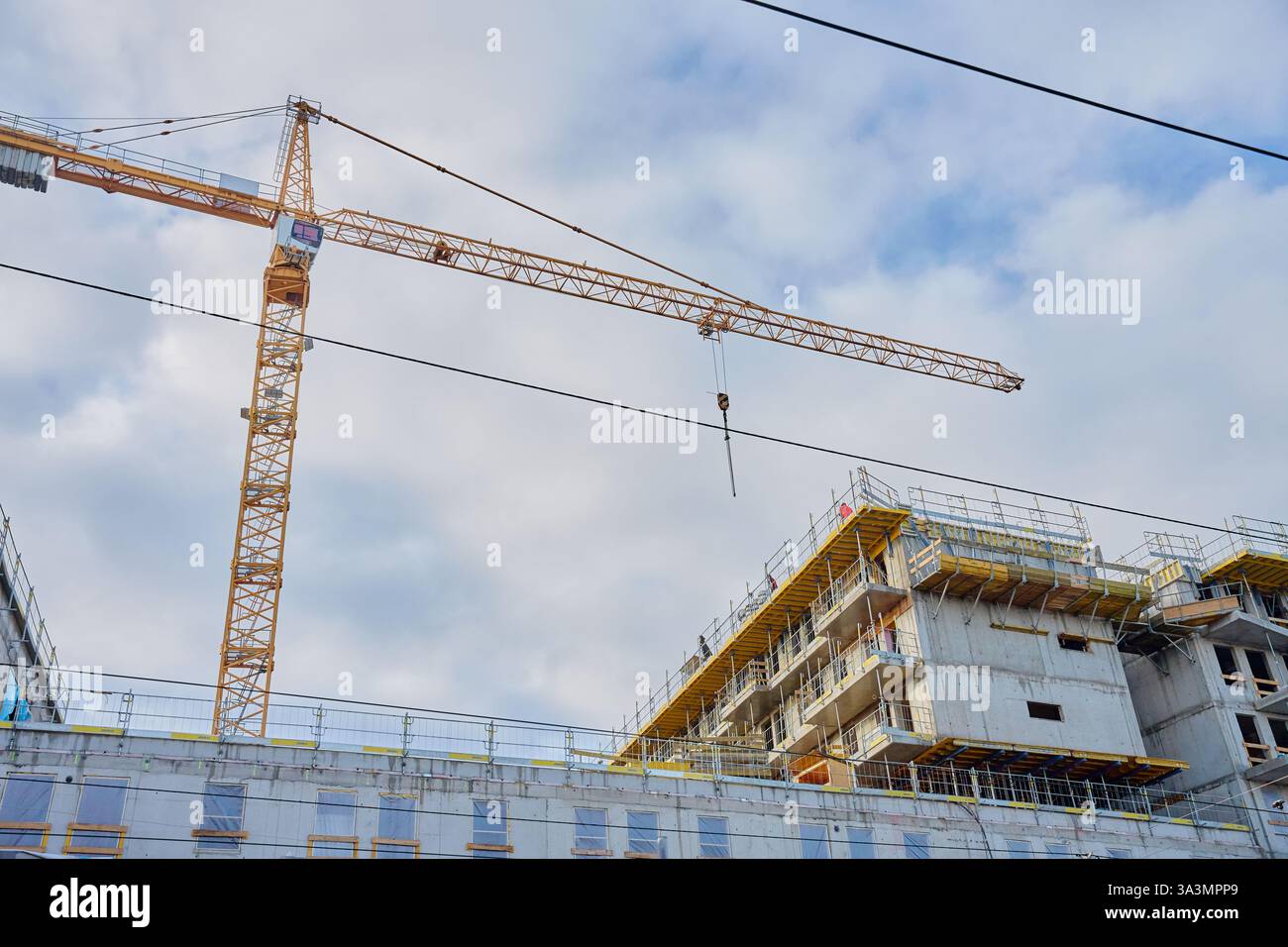 Unfinished concrete multi story building under construction with ...