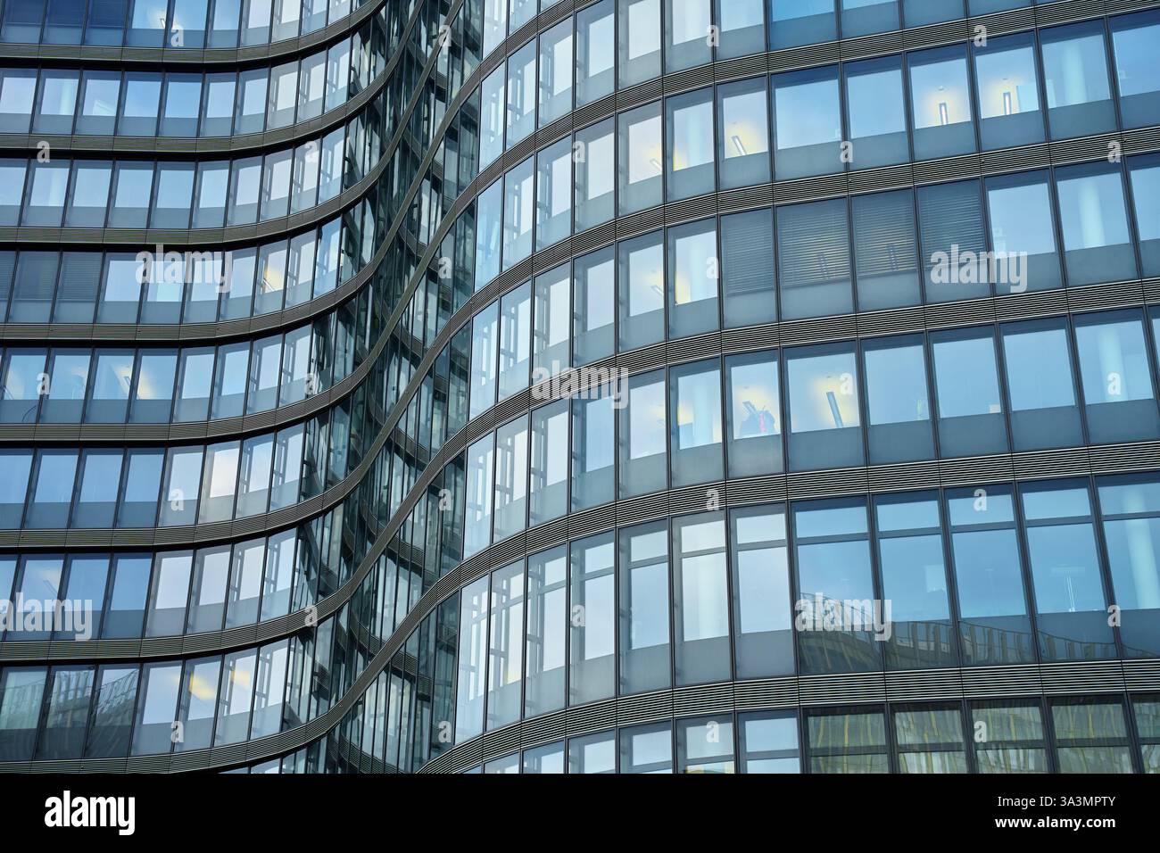 Modern curved high rise building. Glass facade of skyscraper. Office ...
