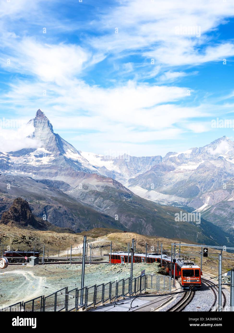 Gornergrat Bahn, red tourist train going up to the Gornergrat train ...