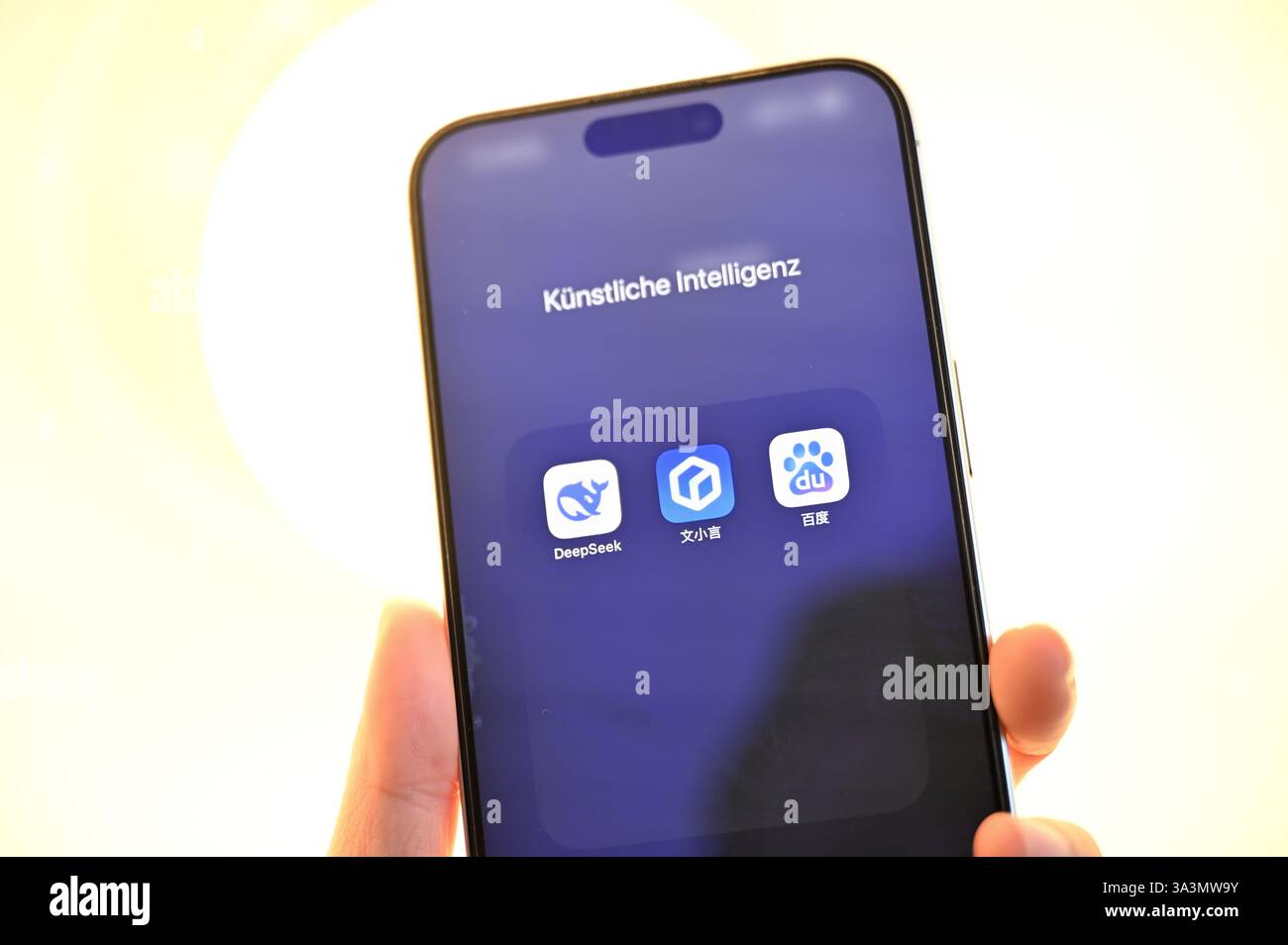 Peking, China. 17th Mar, 2025. On a cell phone display, the blue logo ...