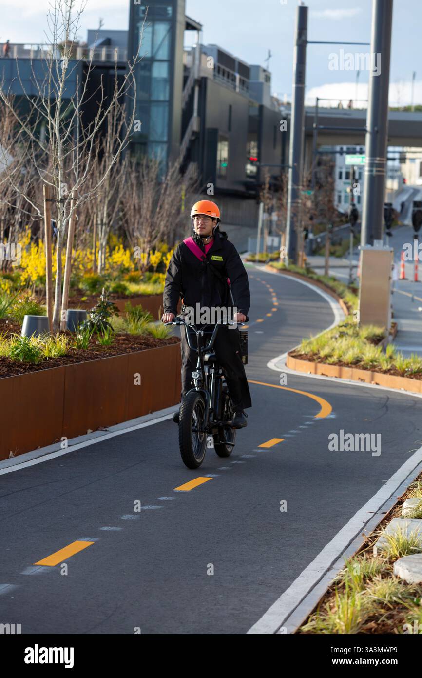 Seattle, Washington, USA. 16th March 2025. A cyclist rides the newly ...