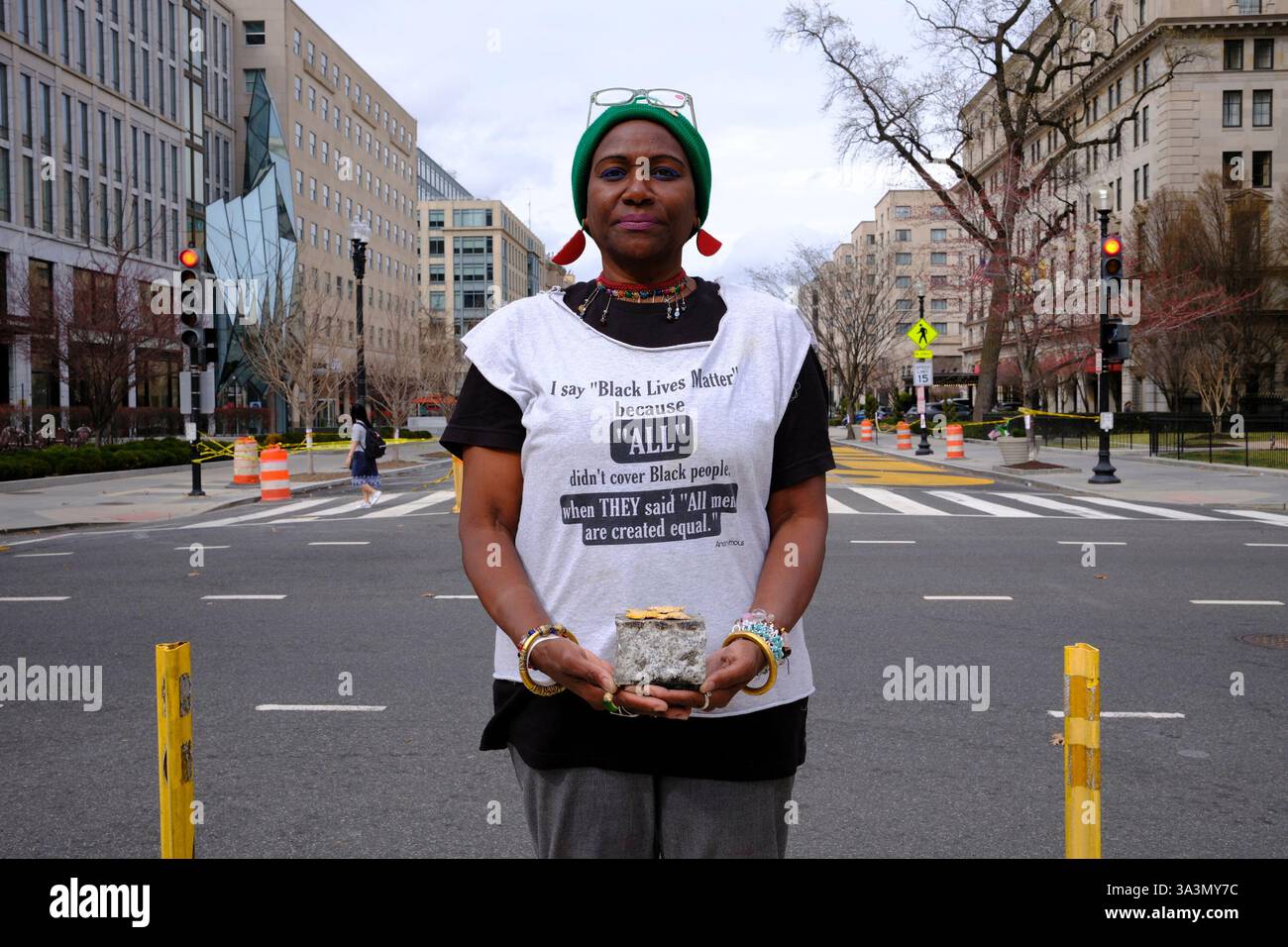 Nadine Seiler, 59, of Waldorf, Maryland, holds a brick and parts of a ...
