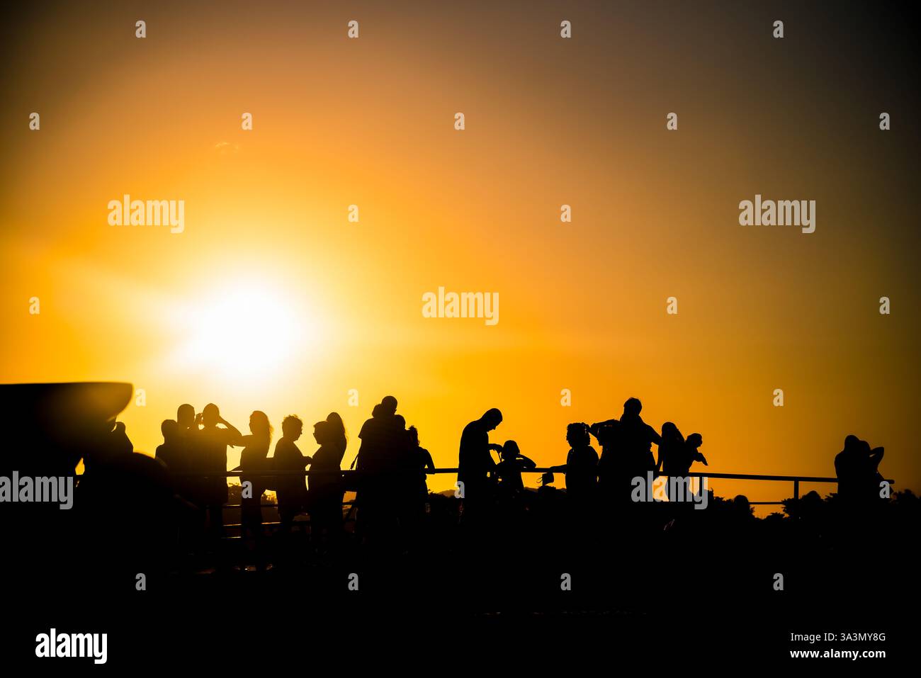 Crowd of tourists gathering for the sunset hi-res stock photography and ...