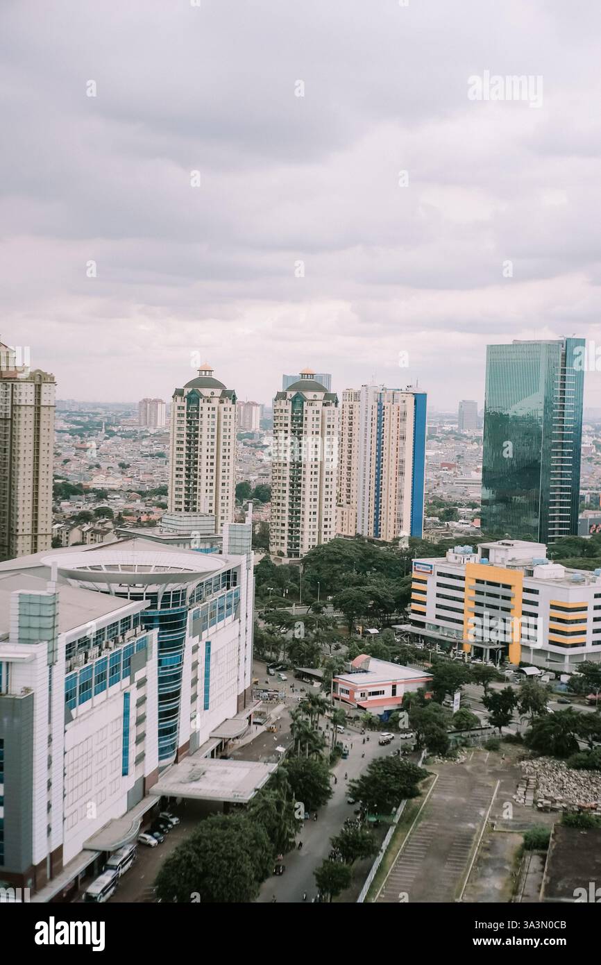 An aerial view of a metropolitan cityscape with towering high-rise ...