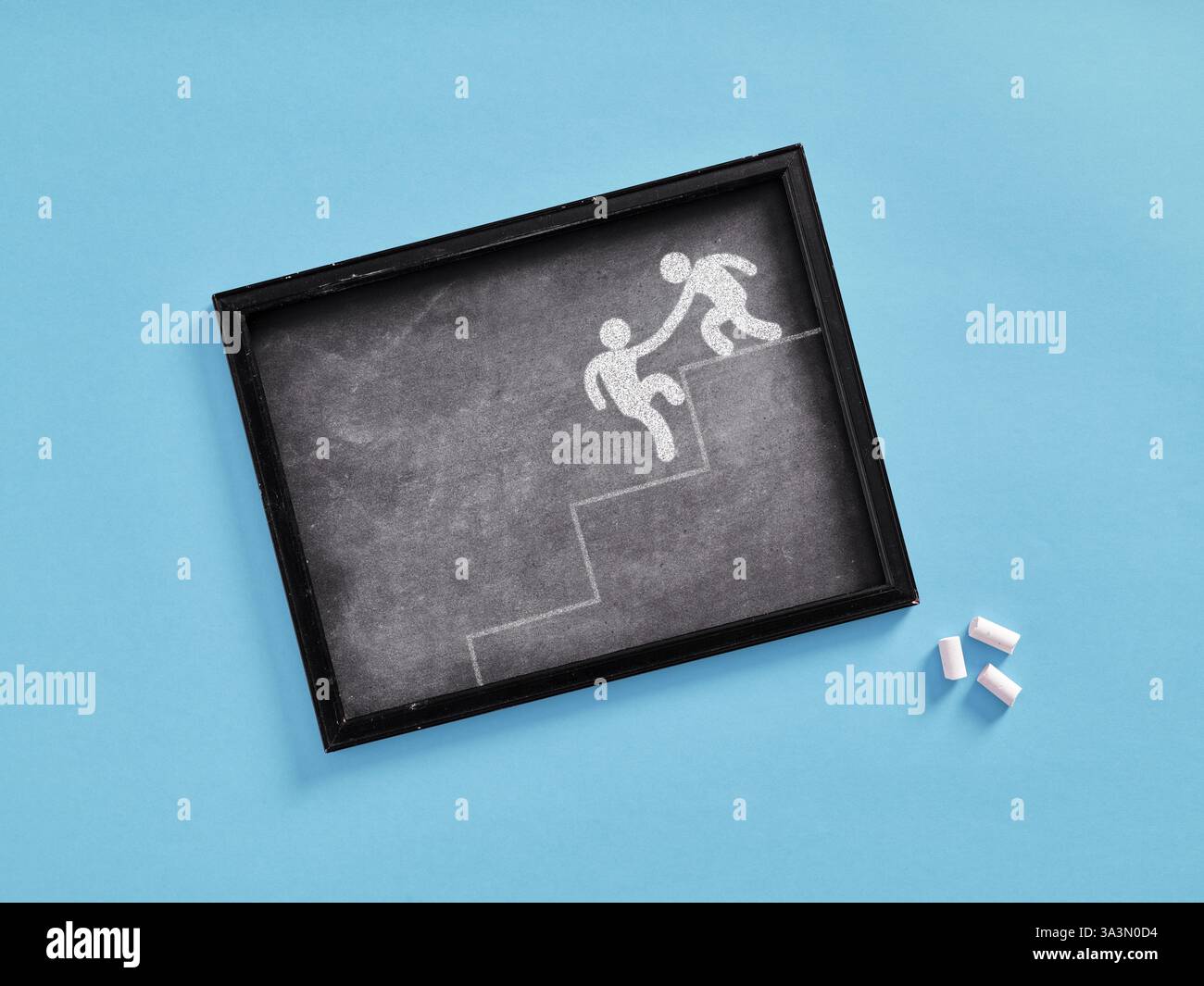 Stick figures climbing stairs drawn in white chalk on a blackboard ...