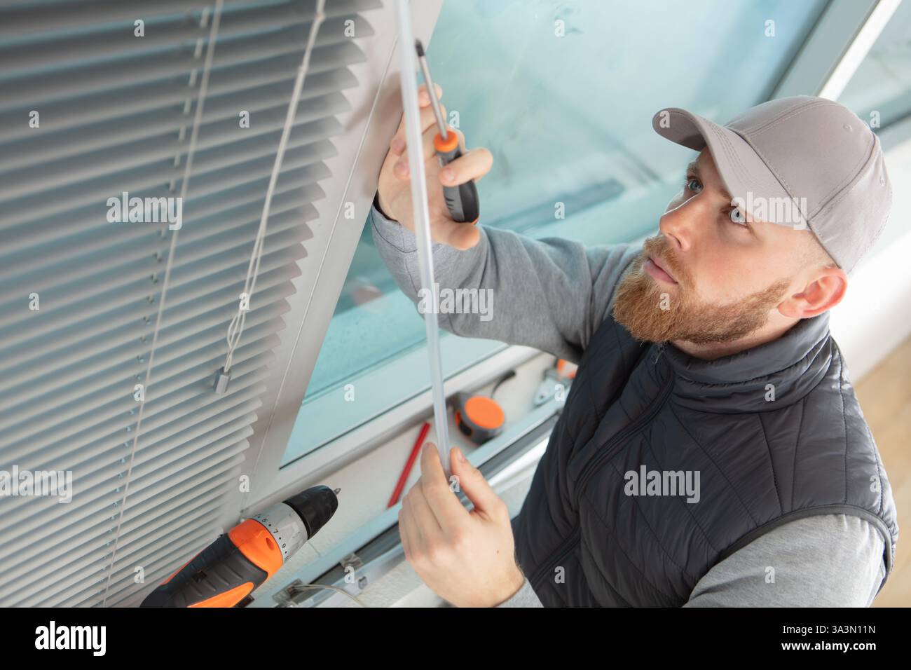 the building inspector checks quality of installation of new windows ...