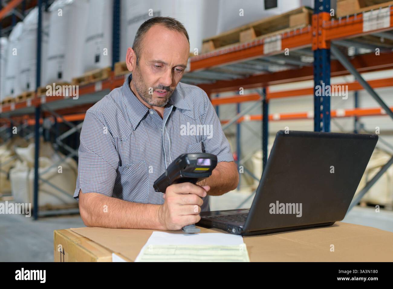 Manager checking packaging goods hi-res stock photography and images ...