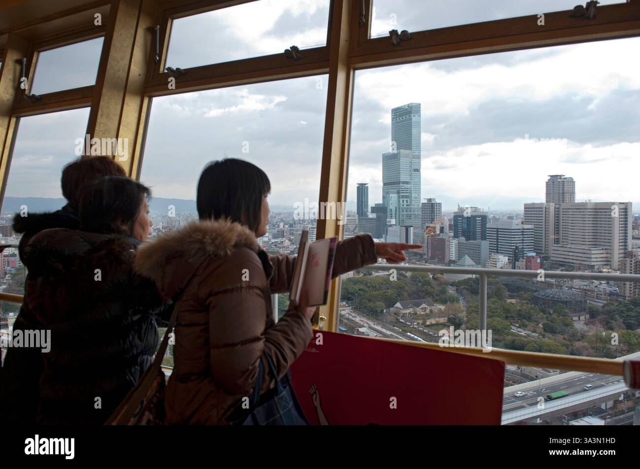 Visitors enjoying the bird's eye view of Osaka city and Abeno Harukas ...