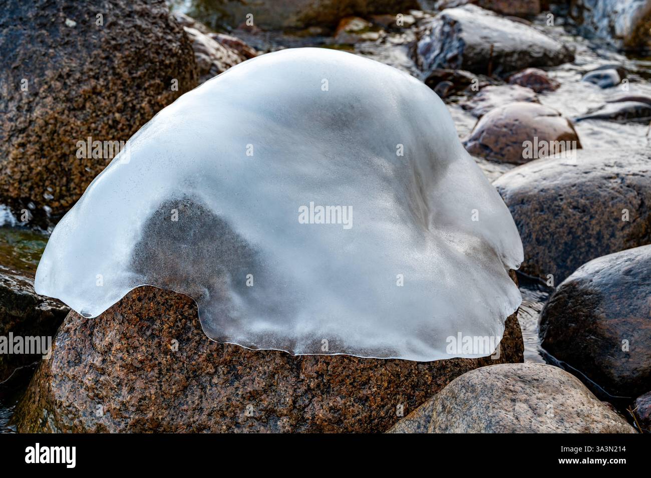 Stone covered in a ice hat Motala Sweden Stock Photo - Alamy