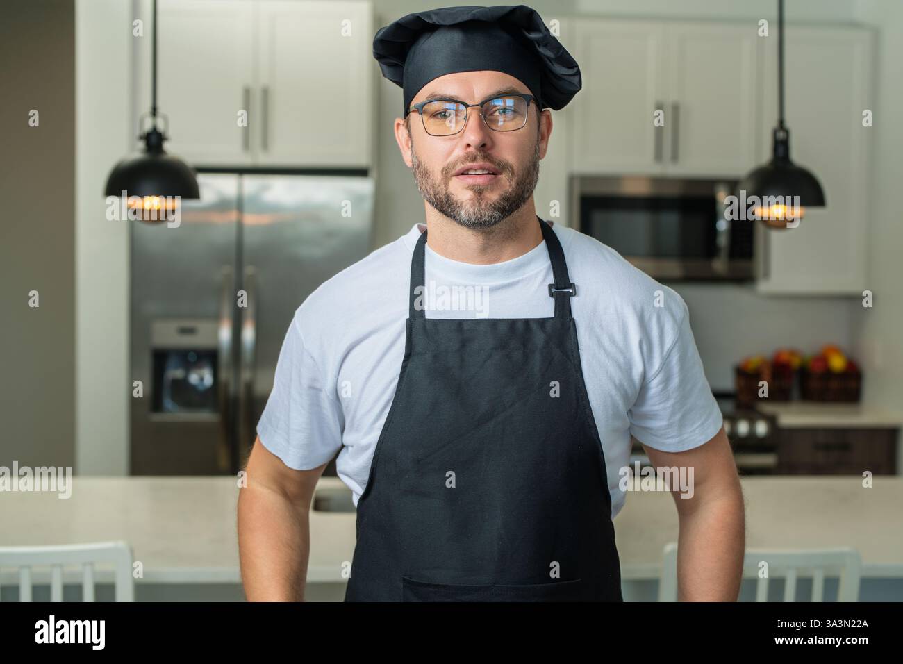 Chef on kitchen. Professional chef man in uniform on kitchen. Bearded ...