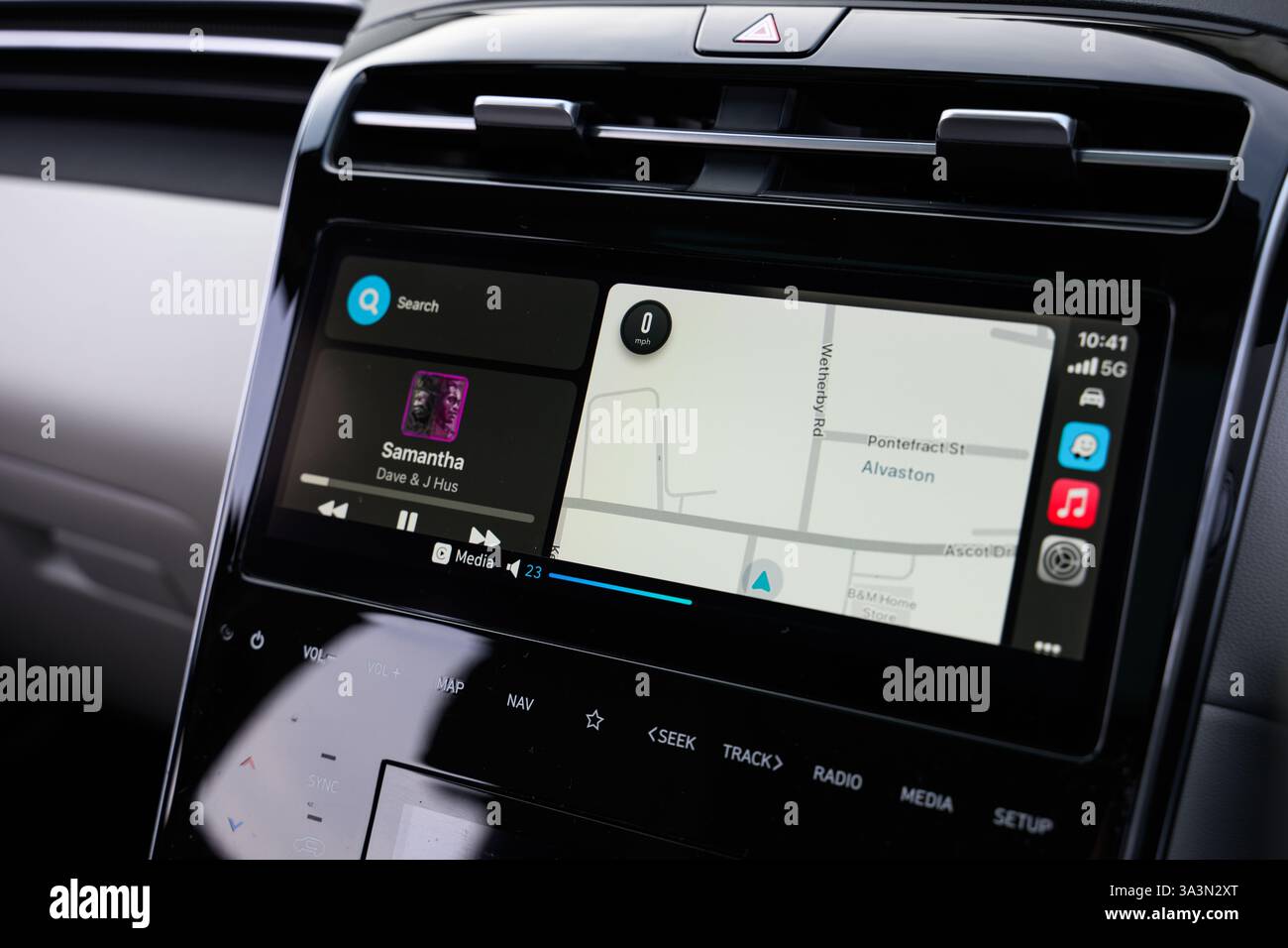 Apple CarPlay showing maps and media control Stock Photo - Alamy
