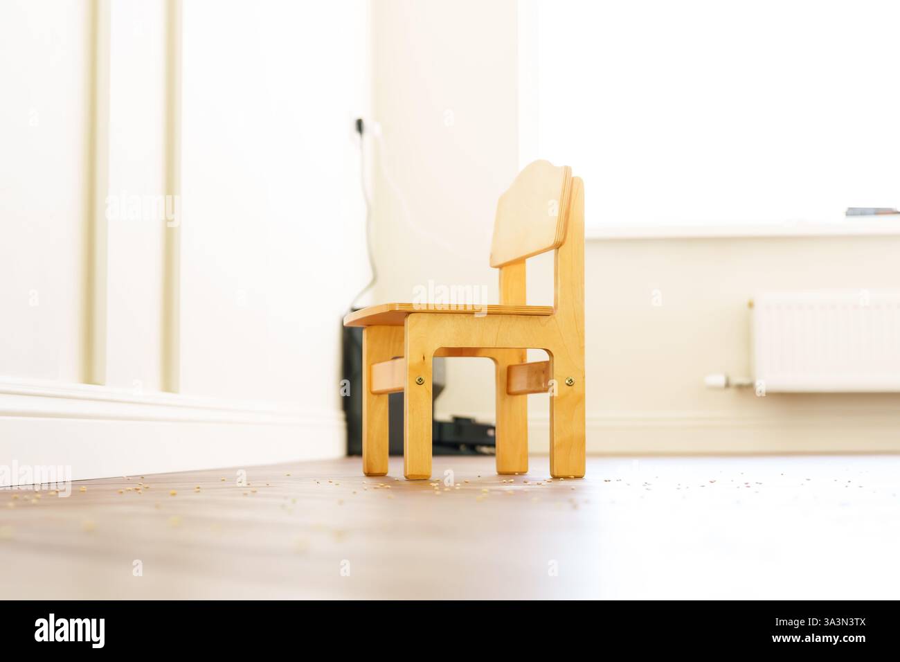 New creative small chair for kids made of solid ash and walnut tree on a white background ...