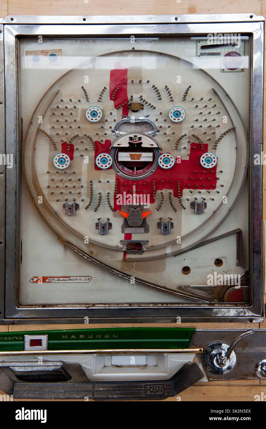A close up front face view of a vintage mechanical Japanese pachinko ...