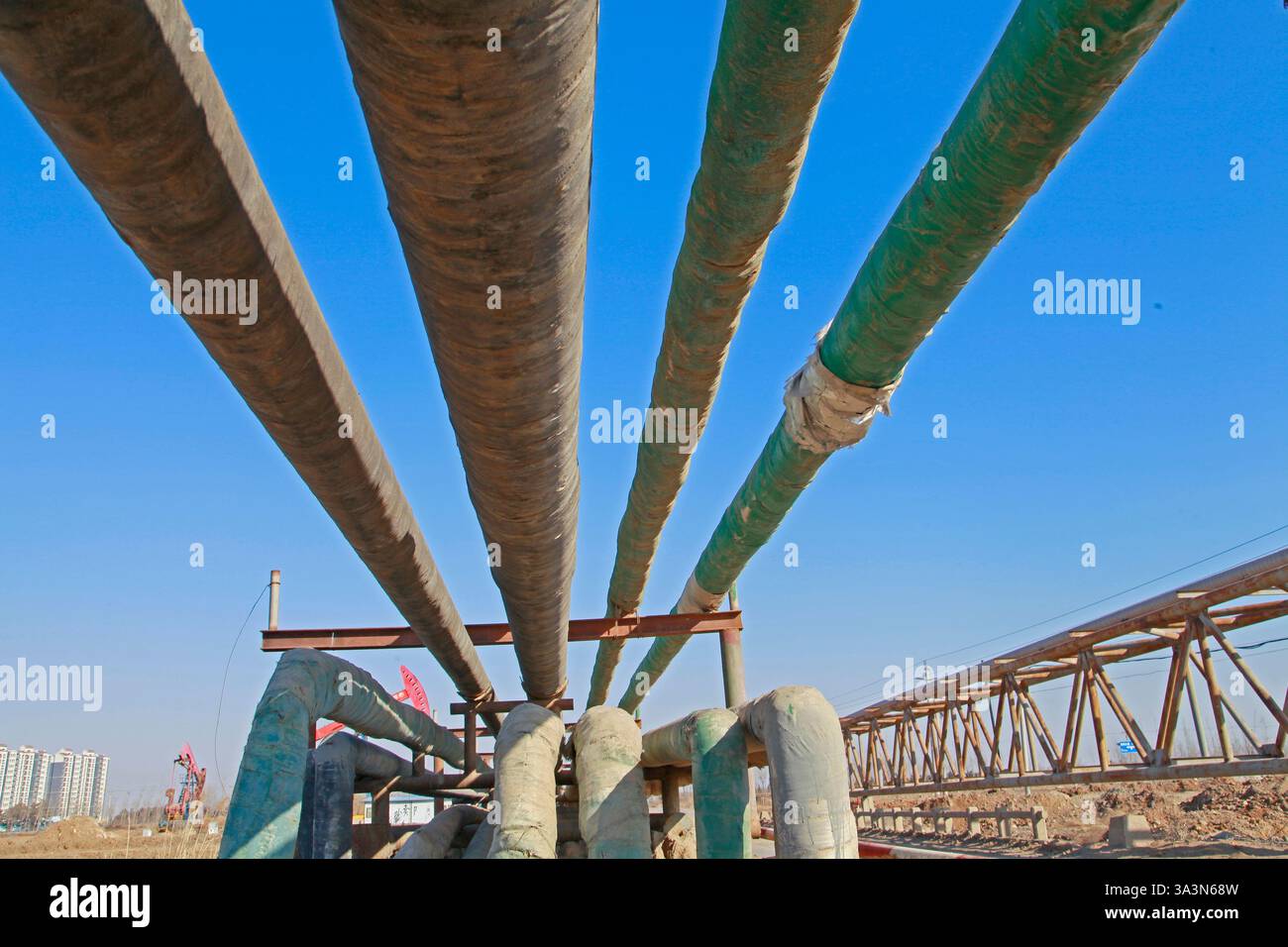 The pipe and valve oil fields Stock Photo - Alamy