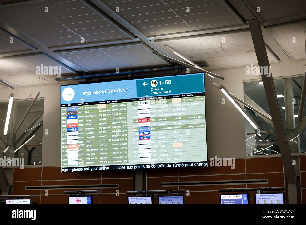 Vancouver, Canada - December 20,2022:Digital flight information display at Vancouver ...