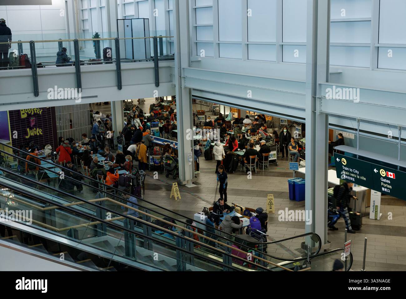 Vancouver, Canada - December 20,2022: Overhead view of crowded Vancouver International Airport ...