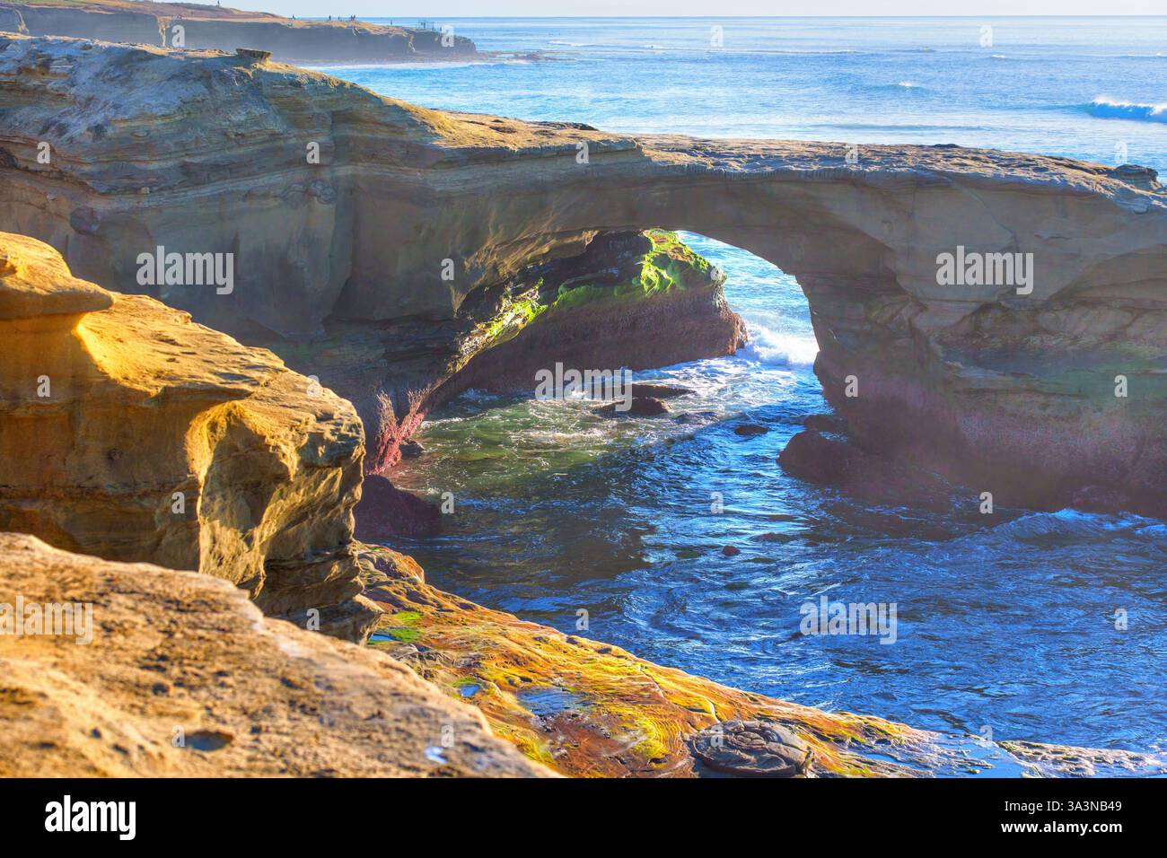 Stunning view of a natural rock arch along the San Diego coastline ...