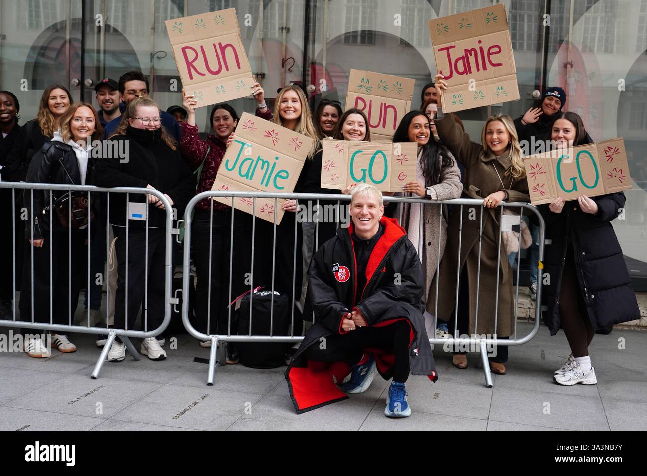 Radio 1 presenter Jamie Laing poses for a photos with supporters ...
