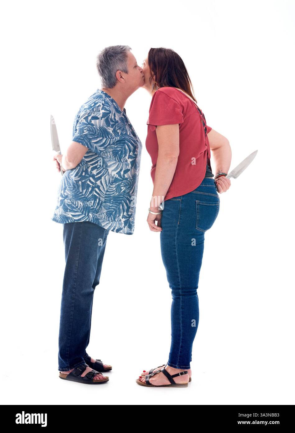 two friends disloyalty in front of white background Stock Photo - Alamy