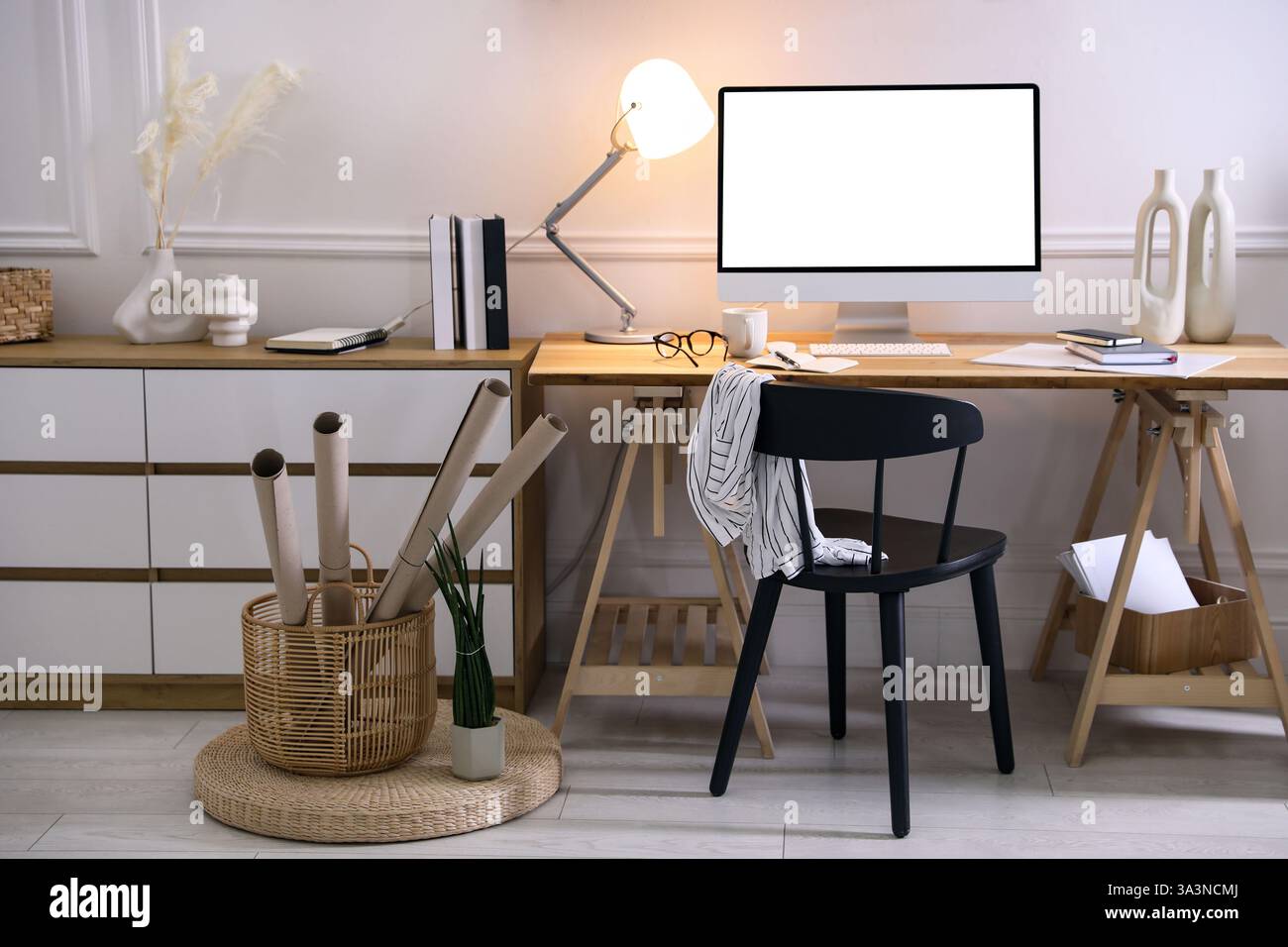 Comfortable workplace at home. Computer monitor with blank white screen ...