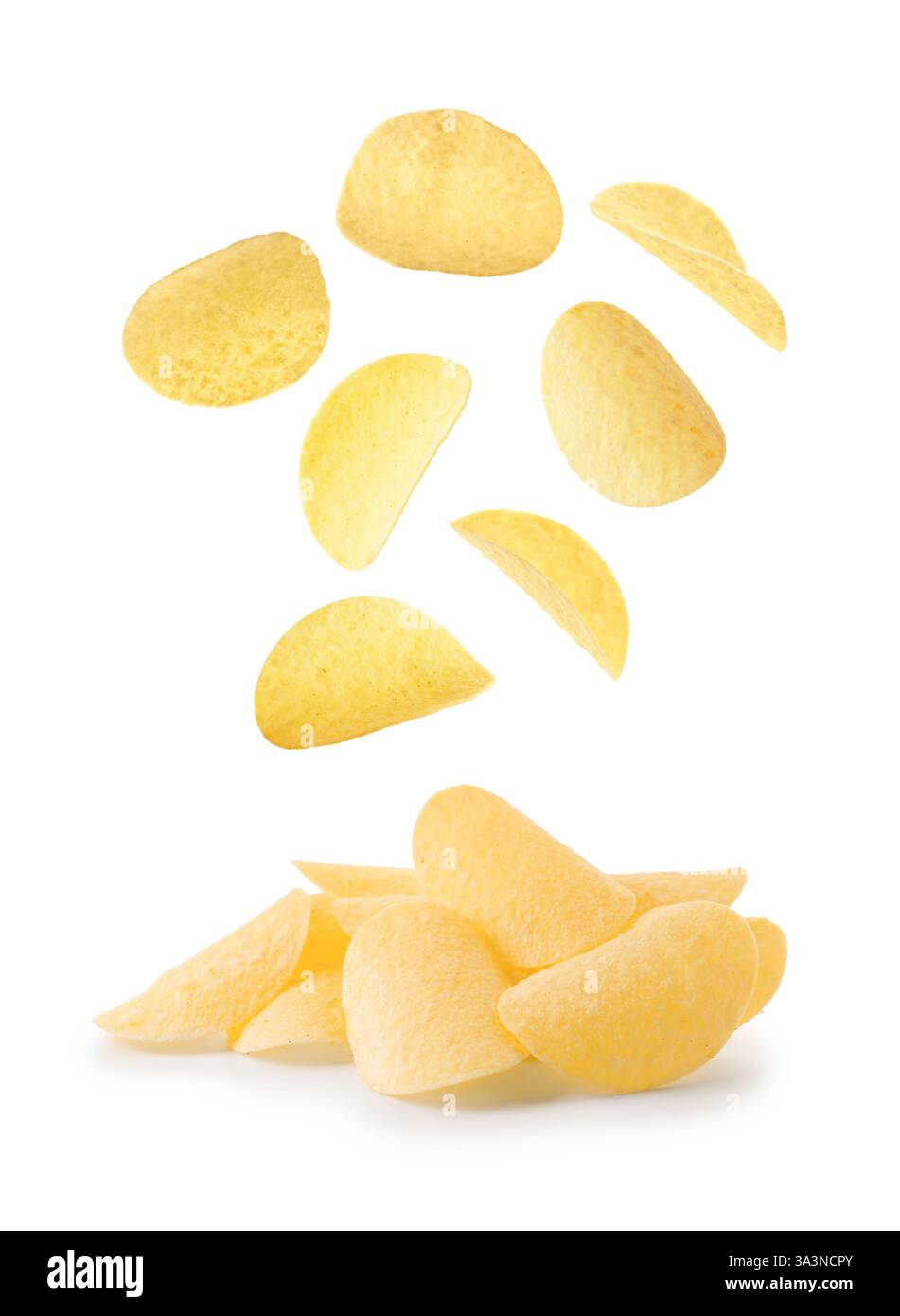Tasty potato chips falling on white background Stock Photo - Alamy