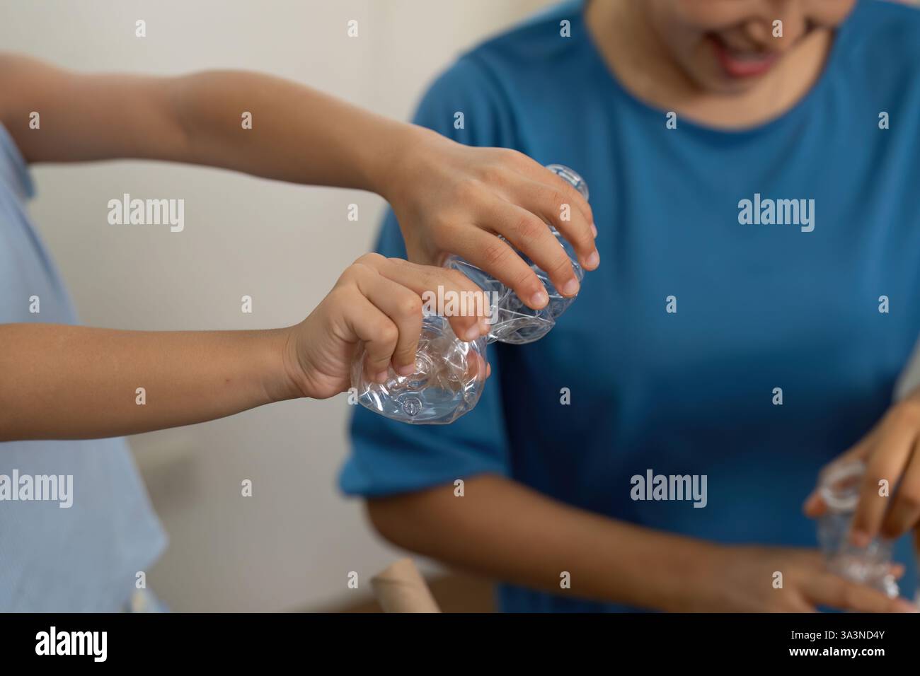 Recycling and Sustainable Practices. Two individuals collaboratively ...