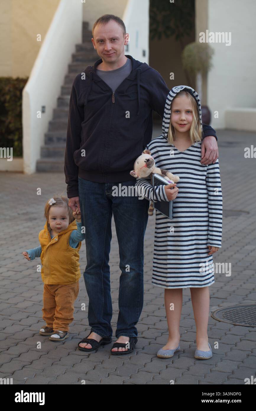Happy father and two daughters together, portrait Stock Photo - Alamy