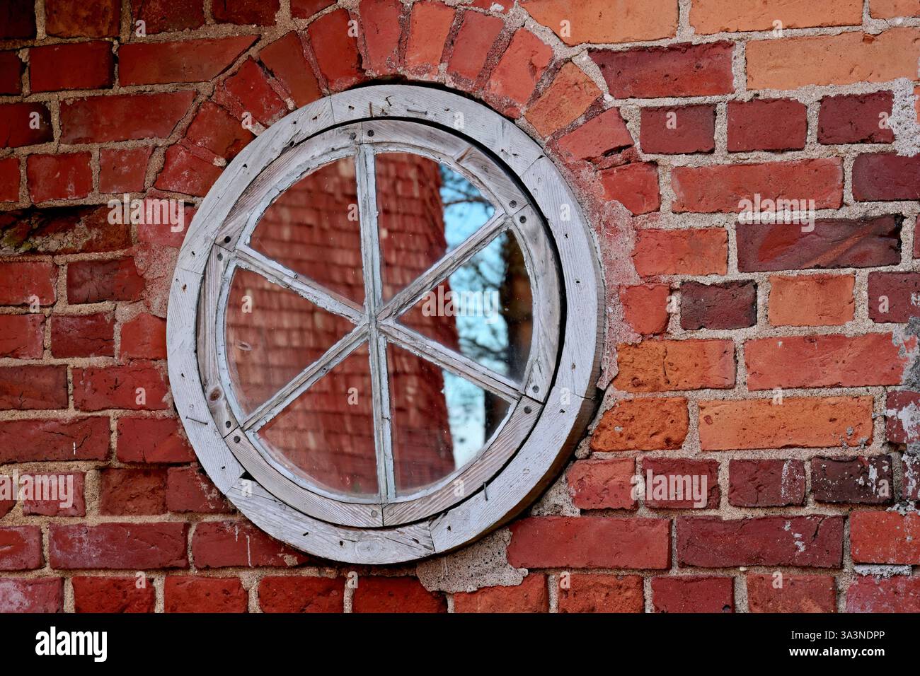Round window on the brick wall Stock Photo - Alamy