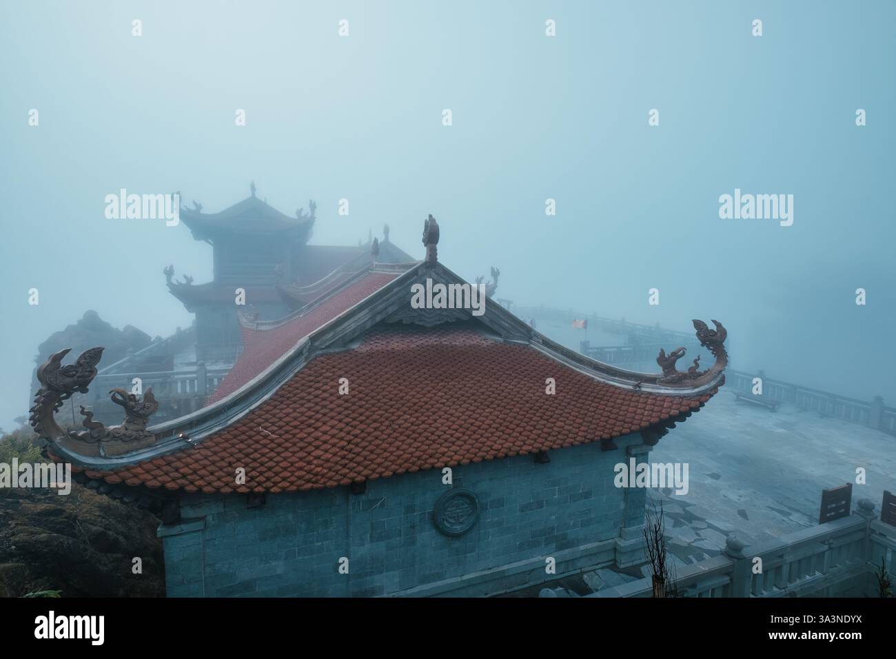 Traditional architectural temple of Fansipan on summit in misty day at ...