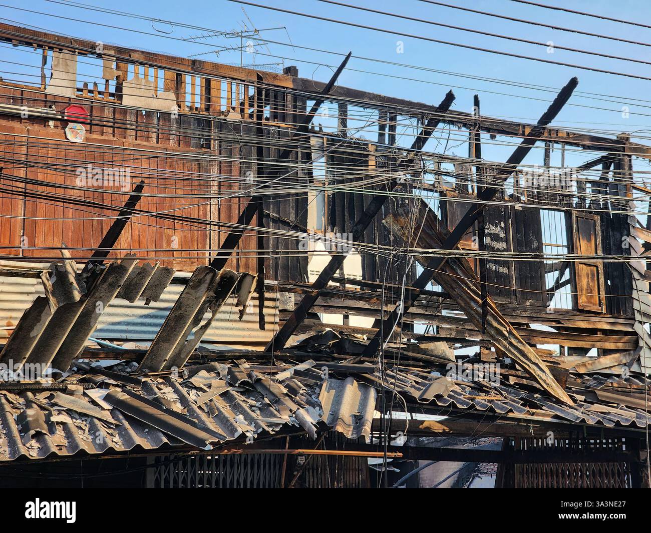 Burnt wooden house that was destroyed by fire, resulting in damage and ...