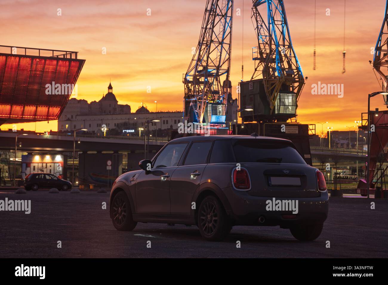 Classic MINI model on city boulevards during spectacular evening Stock ...
