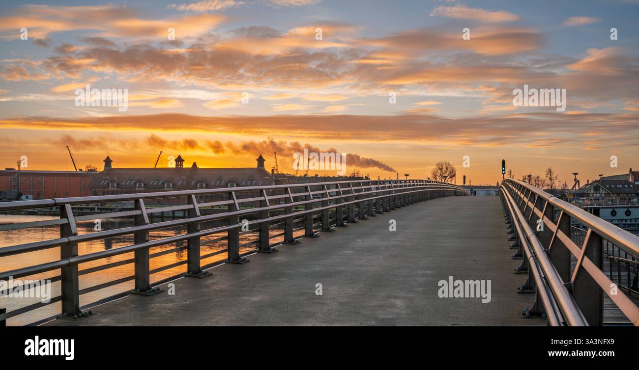 Pedestrian bridge over the Oder River in Szczecin, Poland during a ...