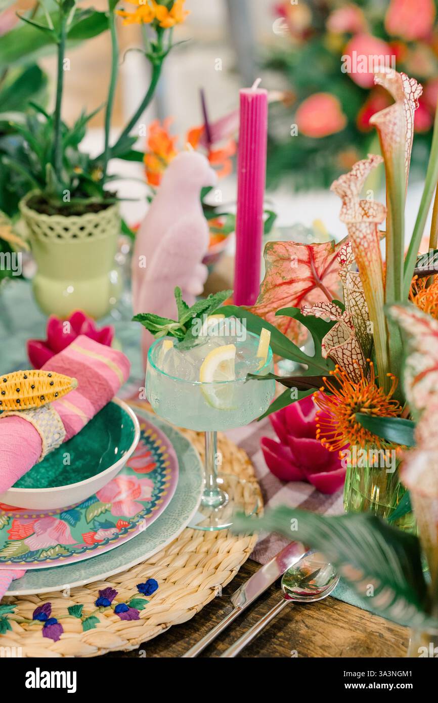 Tropical table setup with colorful décor and cocktail garnish Stock ...
