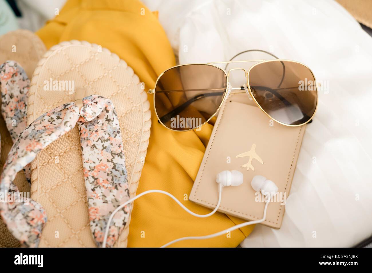 Spring break travel essentials with luggage tag Stock Photo - Alamy