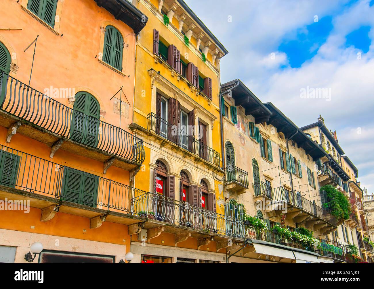 Verona, Italy. Traditional colorful building with balconies, shutter ...