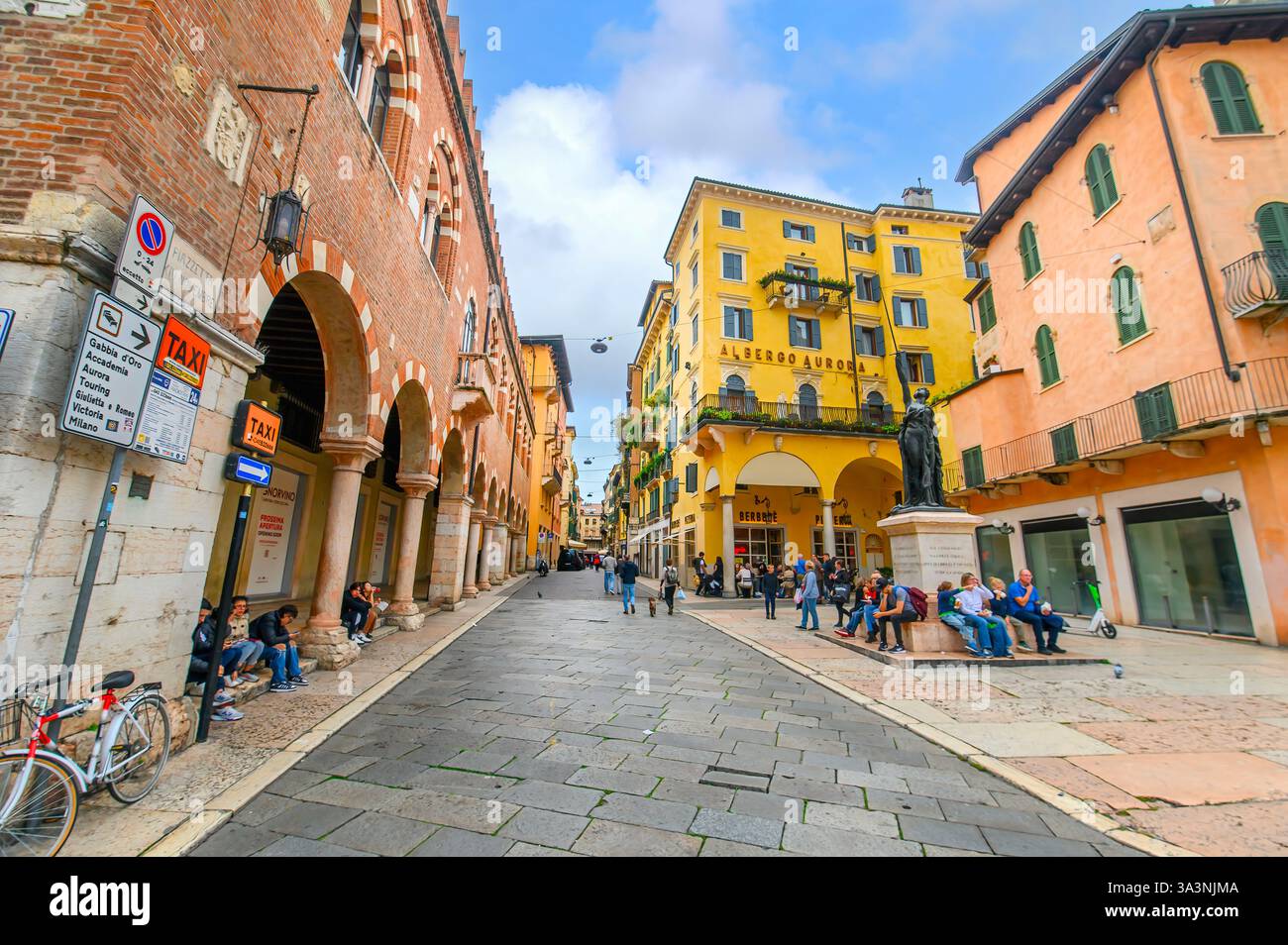 Verona, Italy. Pedestrian streets of colorful buildings with luxury and ...