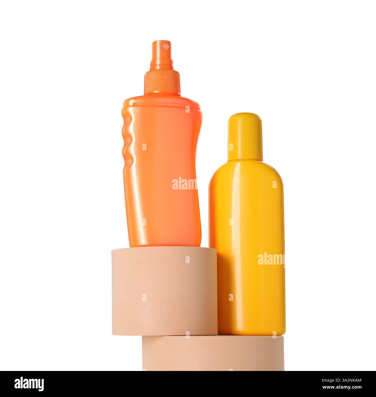 Bottles of sun protection products on podiums against white background ...