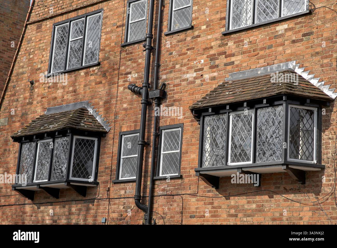 Leaded light Bay Windows. House exterior, England, UK Stock Photo - Alamy