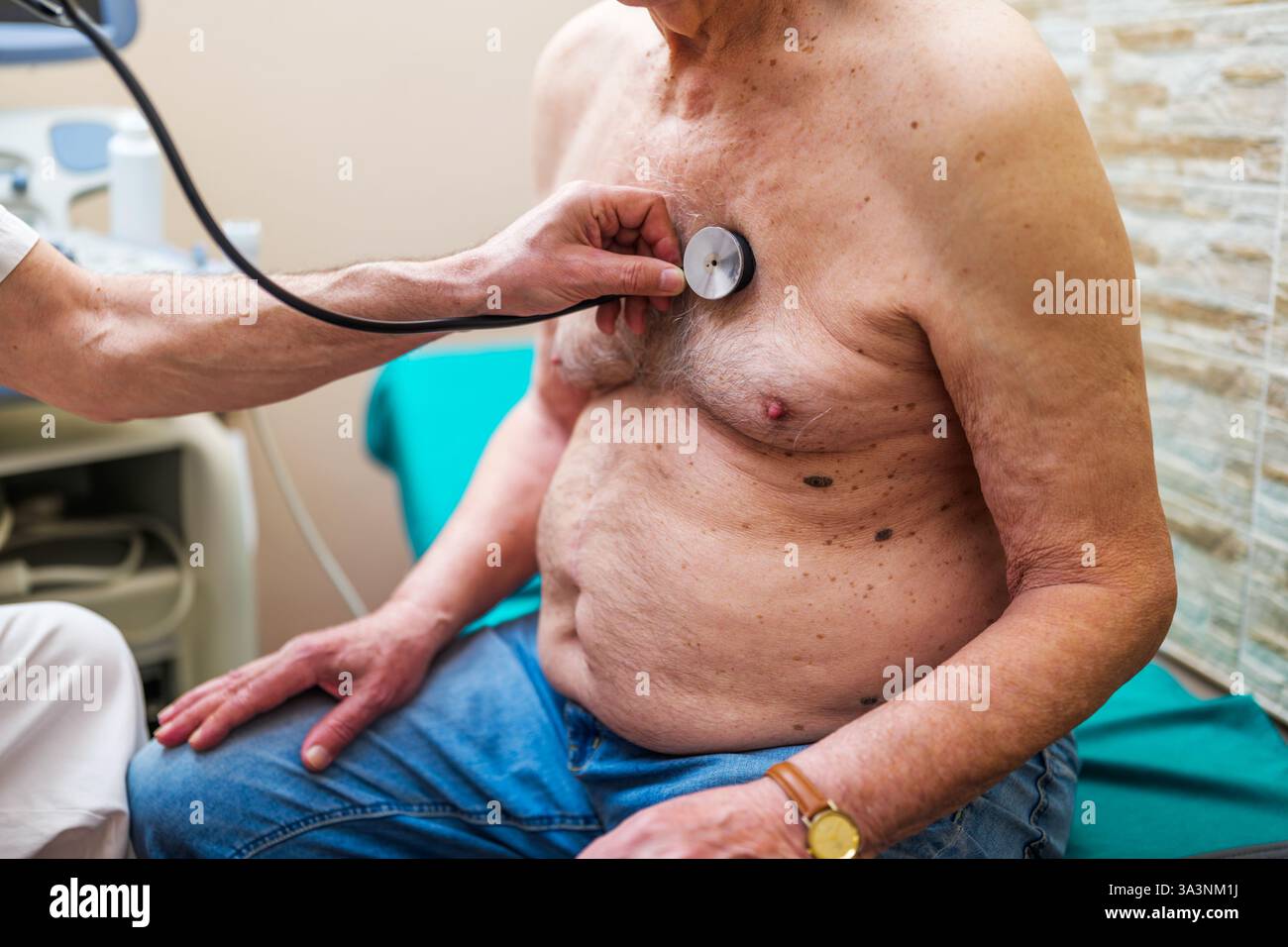 Patient is having exam at cardiologist. Doctor is listening heart beats ...