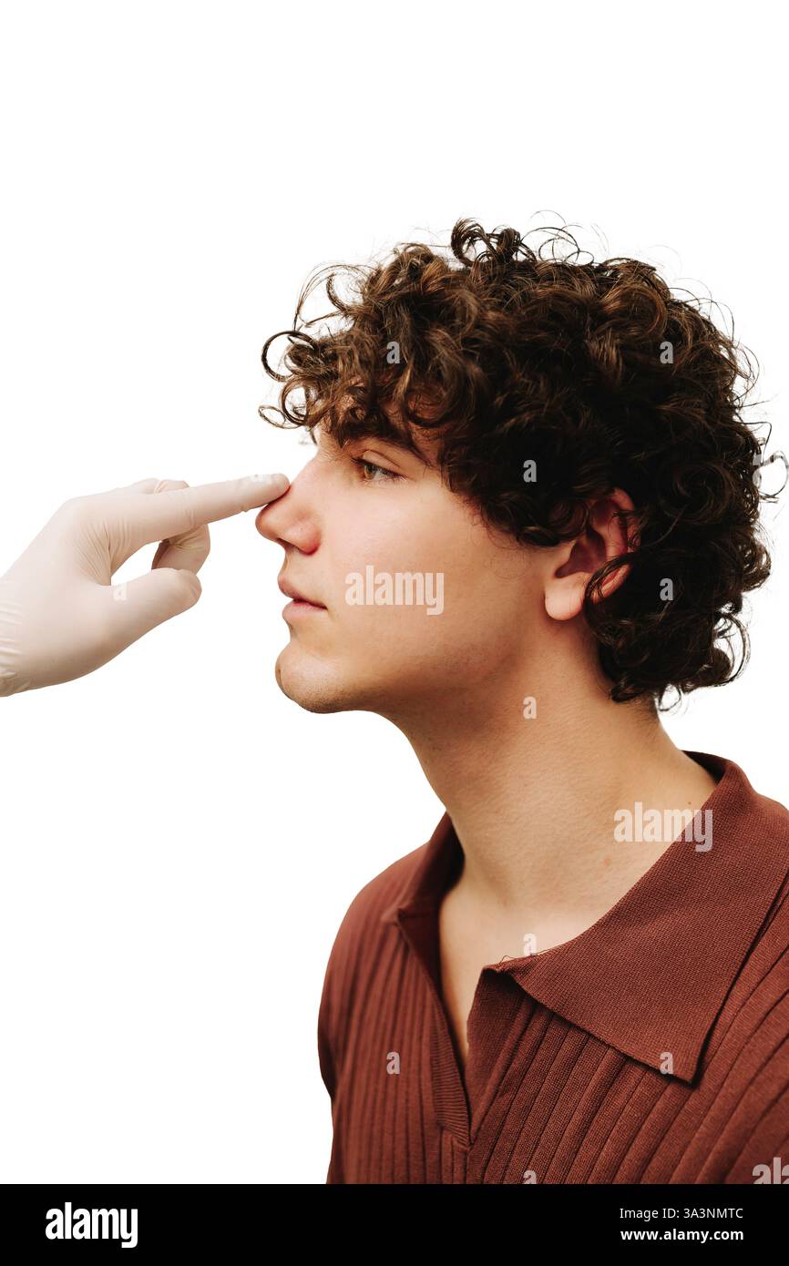 ENT doctor touching nose of patient before rhinoplasty or septoplasty ...