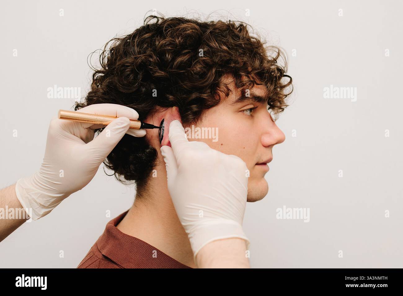 ENT doctor drawing mark up lines before plastic surgery for reshaping ...