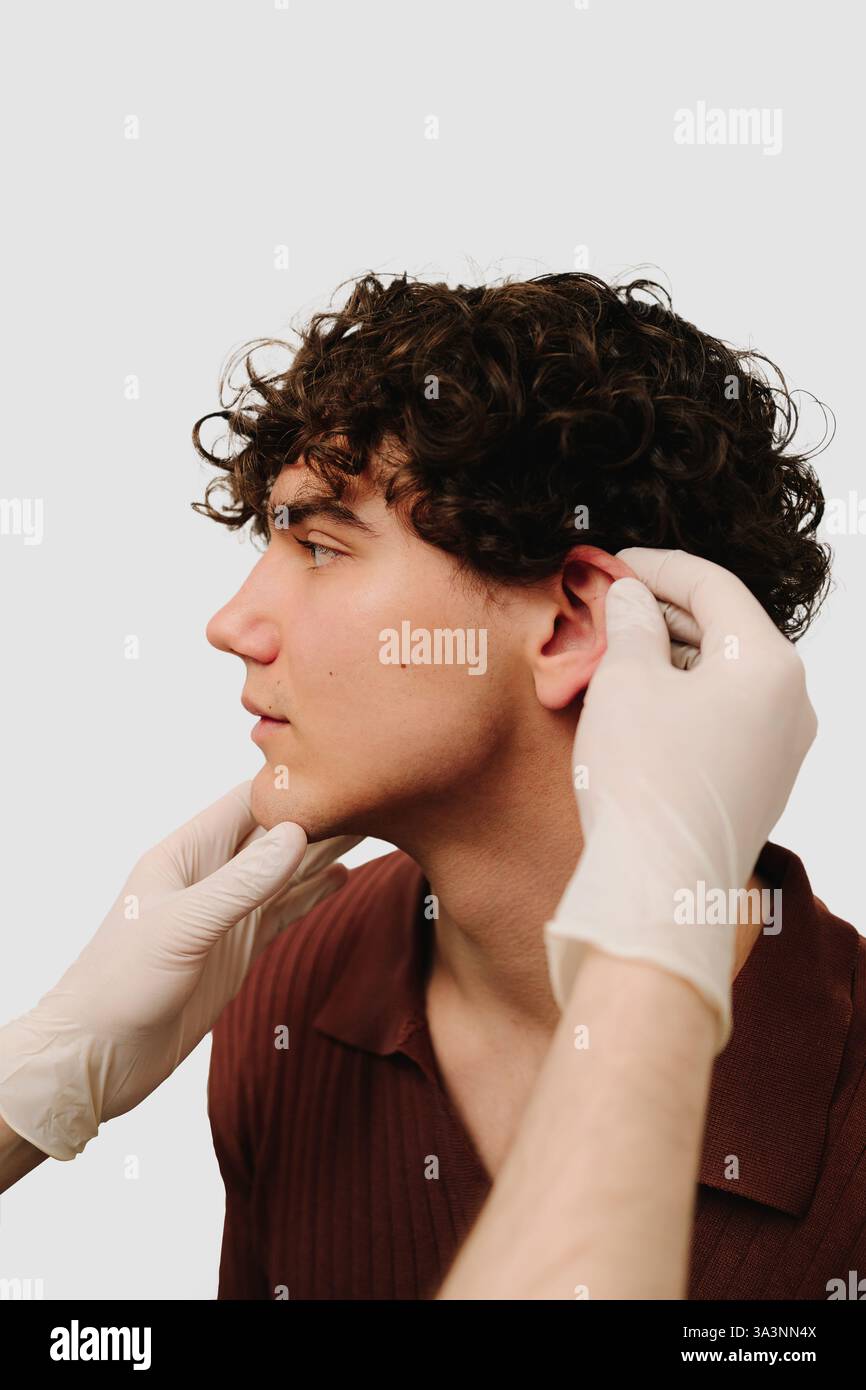 ENT doctor preparing patient for rhinoplasty surgery that changes the ...