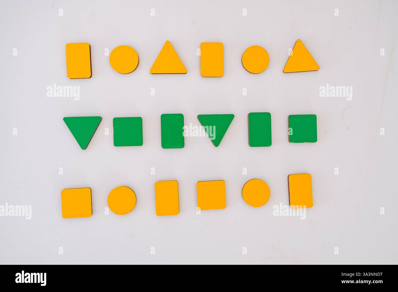 Colorful wooden geometric shapes circle, square, triangle and rectangle ...