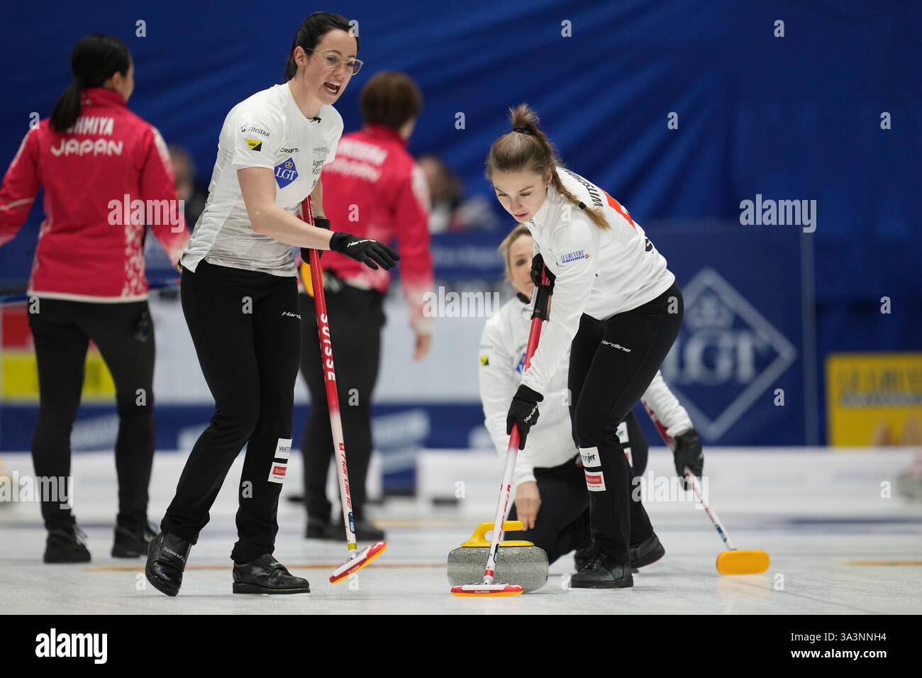 Switzerland's Carole Howald and Selina Witschonke sweep during the ...