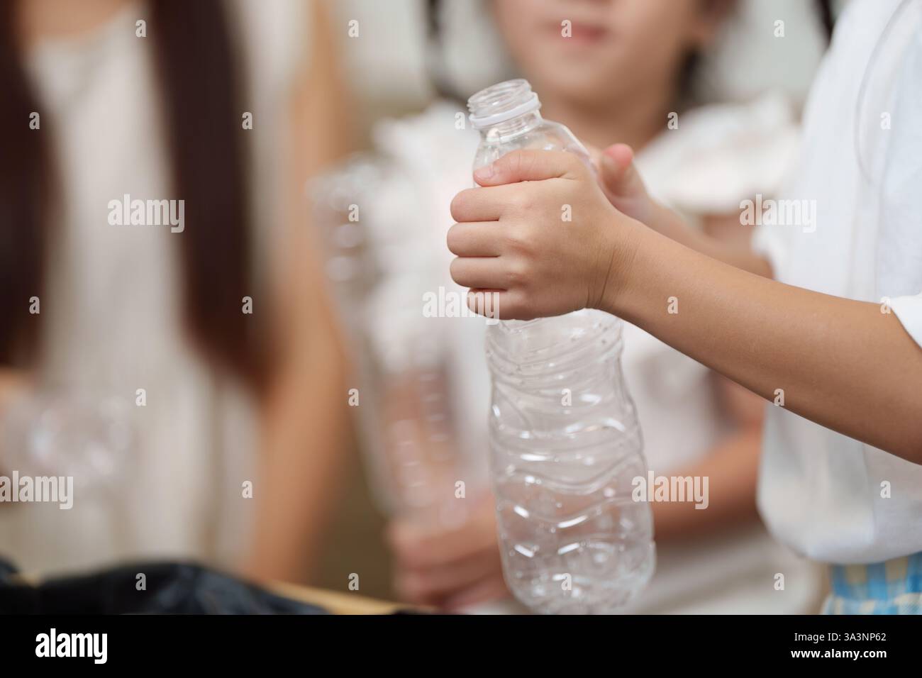 Sustainability and Recycling Education. A child demonstrates the proper ...